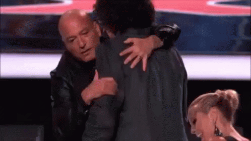 Hug GIF - Awkward Hug AGT - Discover & Share GIFs